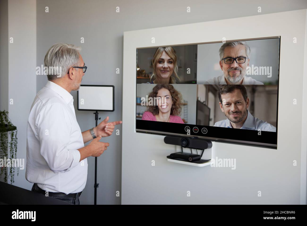 Technology television communication gesturing hi-res stock photography ...