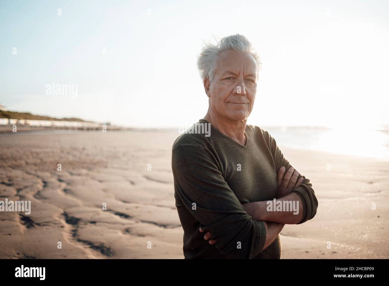 Man walking on sunny beach hi-res stock photography and images - Alamy