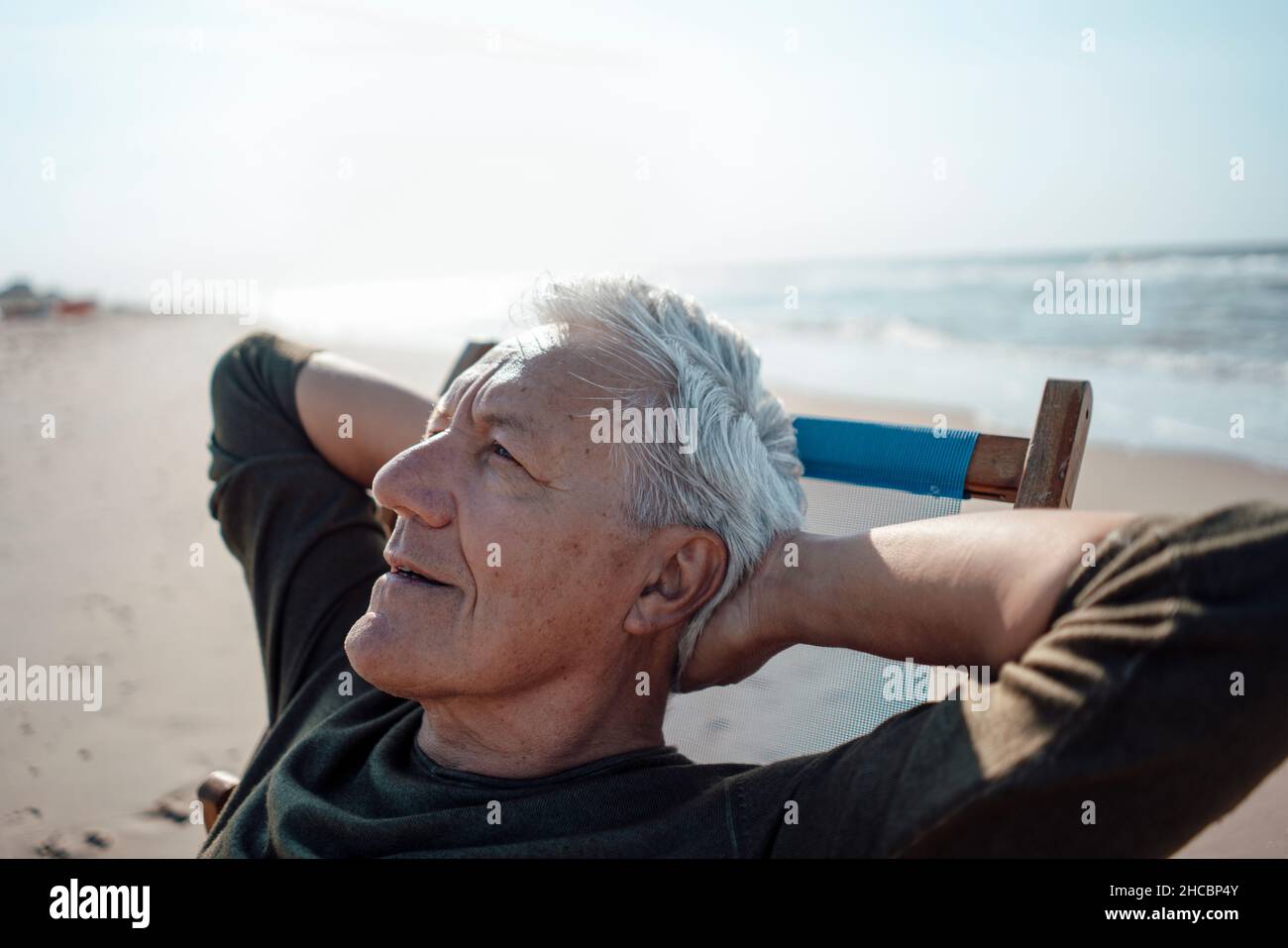 One man beach raising hands hi-res stock photography and images - Alamy