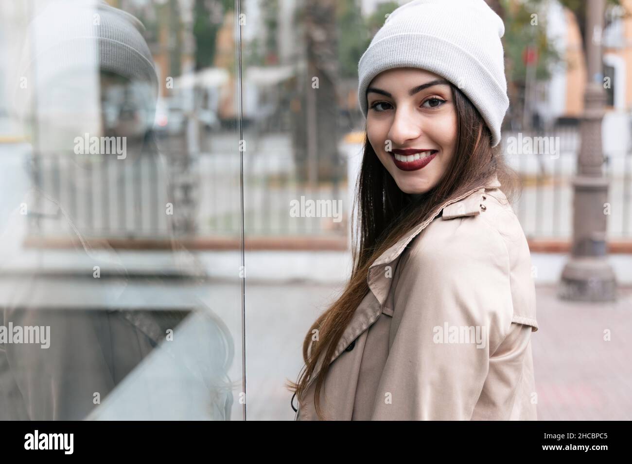Woman looking over wall hi-res stock photography and images - Alamy