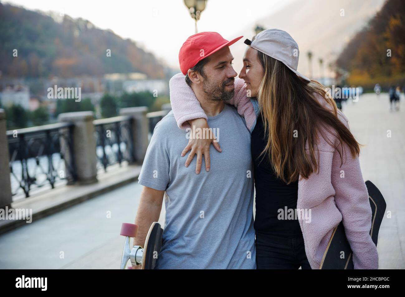 Man walking arm around woman hi-res stock photography and images - Alamy