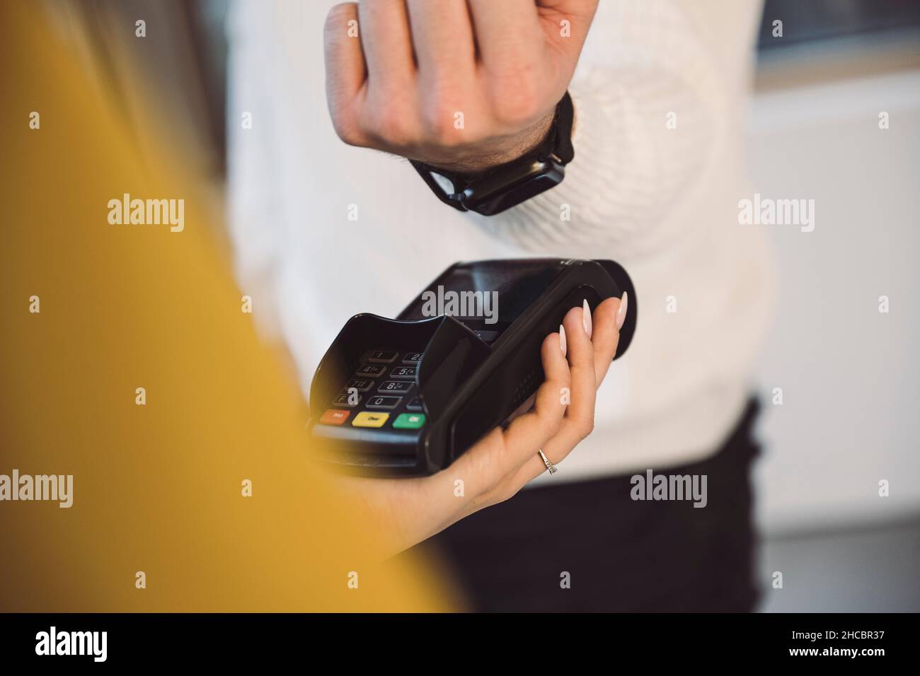 Paying smartwatch in cafe contactless hi-res stock photography and ...