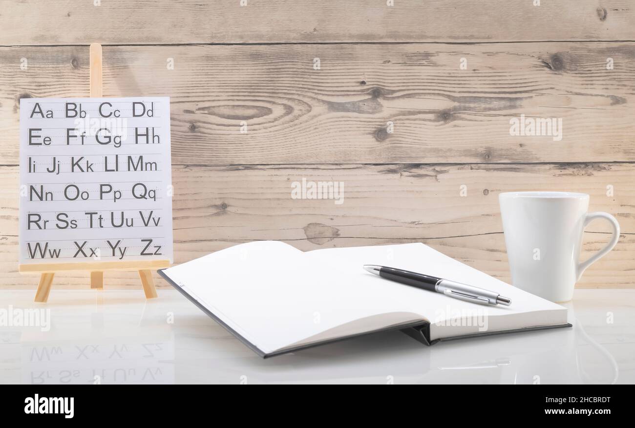 Open book on a workspace Stock Photo - Alamy