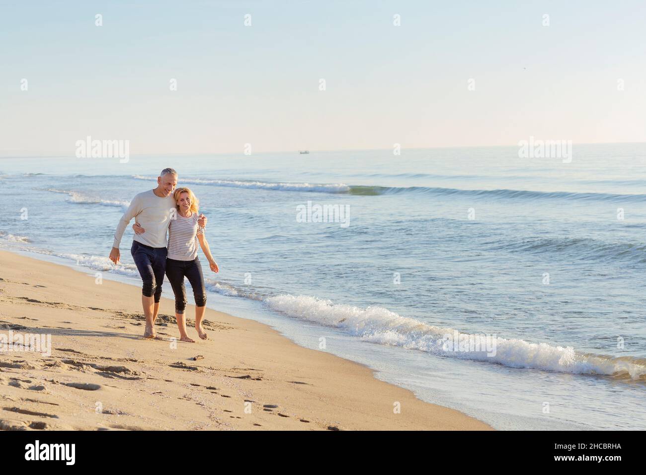 Couple spending leisure time at beach Stock Photo - Alamy