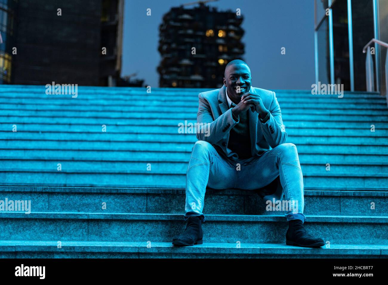 Sitting on steps night hi-res stock photography and images - Alamy