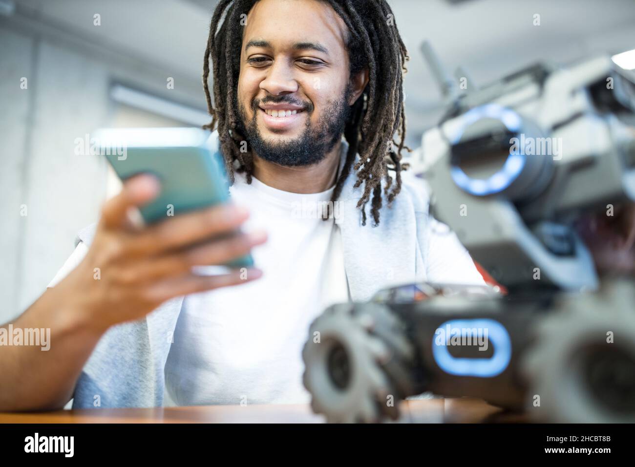 Engineer operating robotic combat tank through remote control at ...