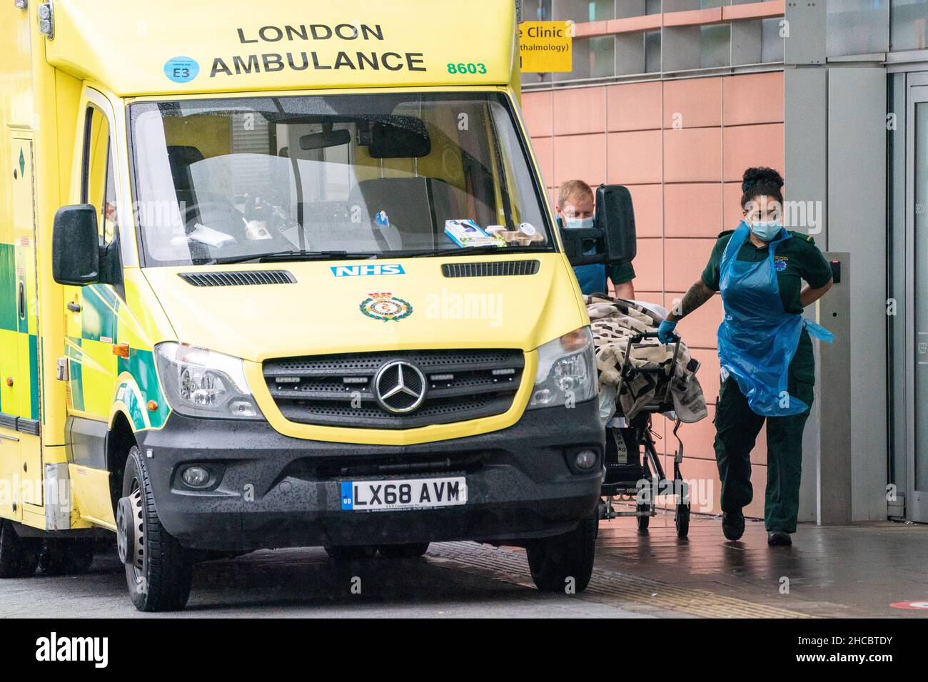 Paramedics transport a patient outside the Royal London Hospital, in ...