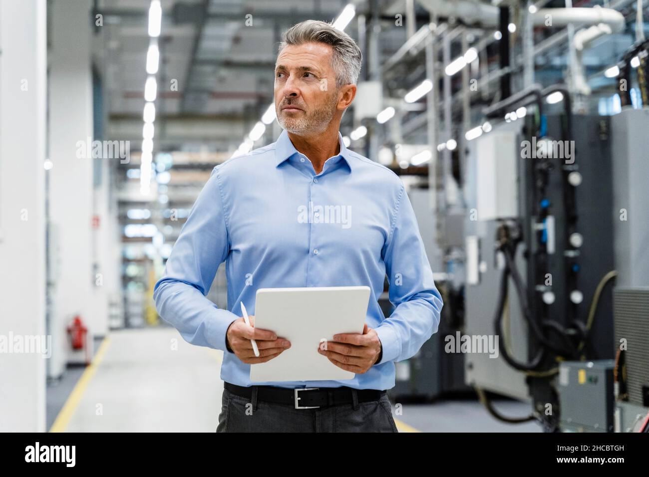 Inspector holding tablet PC at modern factory Stock Photo - Alamy Inspector holding tablet PC at modern factory Stock Photo - Alamy