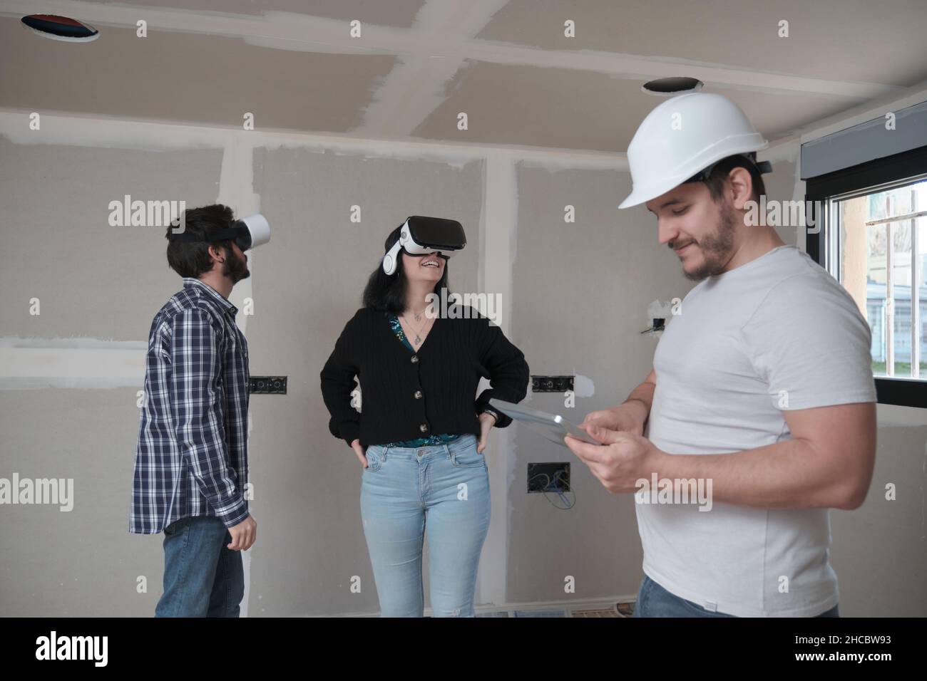Couple with vr goggles watching virtual project at their new home Stock ...