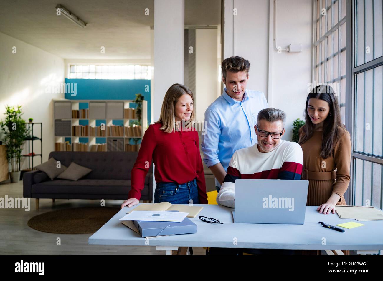 Standing behind desk hi-res stock photography and images - Alamy