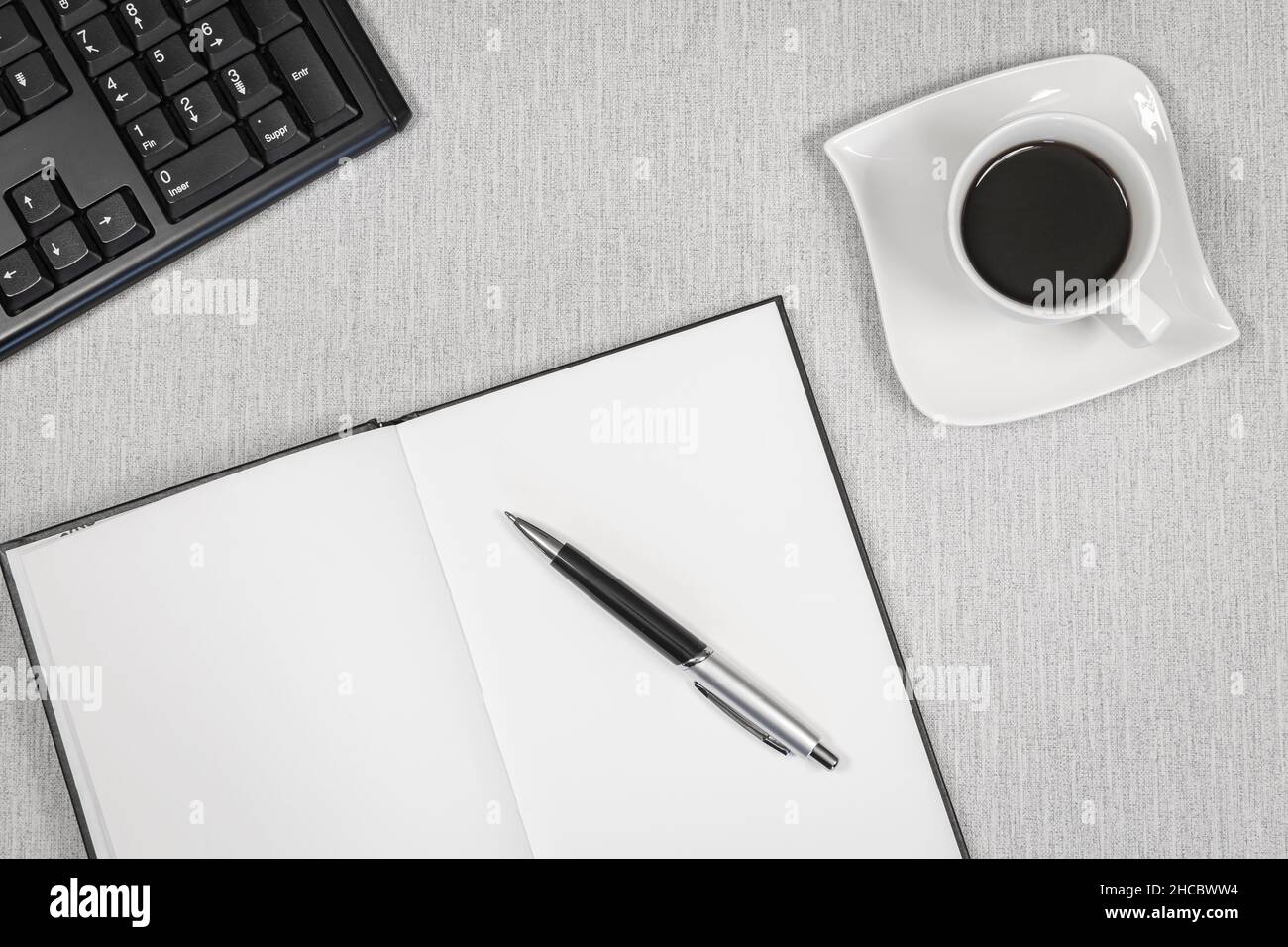 Open book on a workspace Stock Photo - Alamy