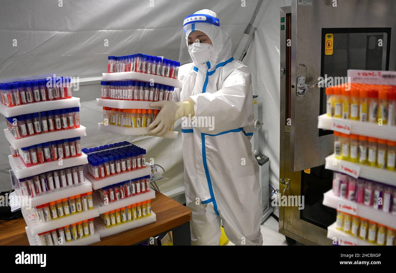 Xi'an, China's Shaanxi Province. 23rd Dec, 2021. A medical worker works ...