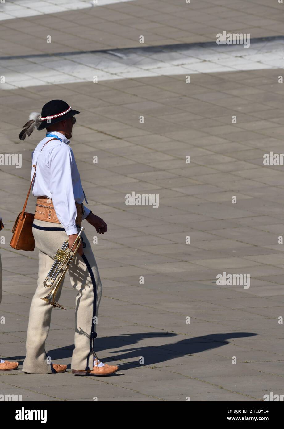 Polish highlander is walking with a trumpet in his hand Stock Photo - Alamy