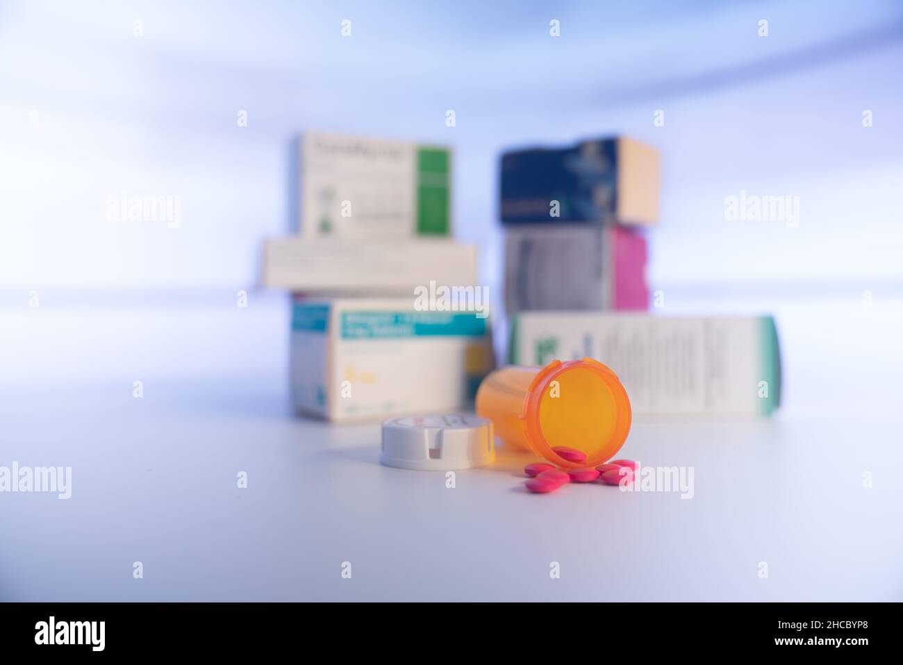 Colorful tablets with capsules and pills on blue background Stock Photo ...