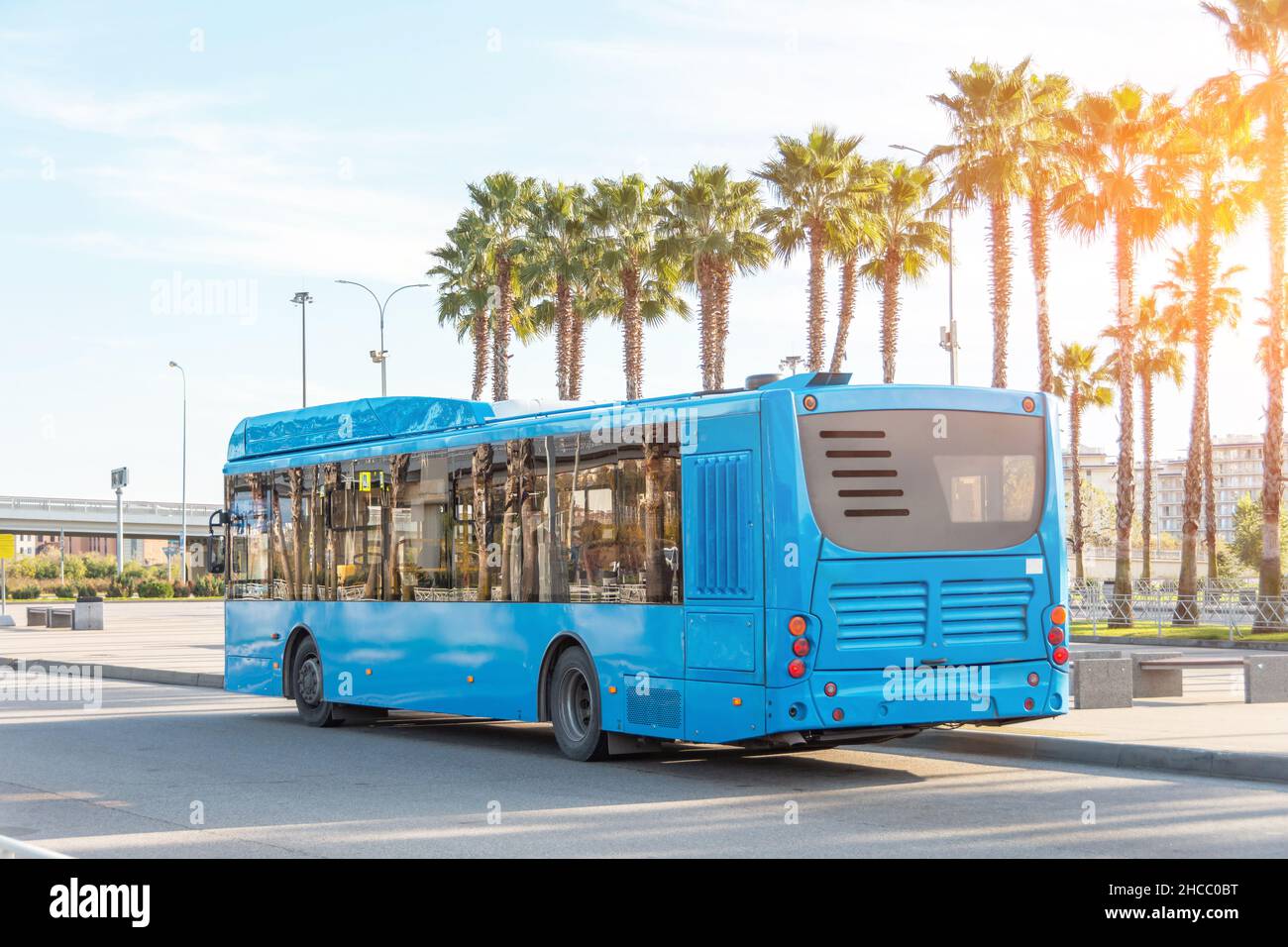Blue city bus at a final stop of the route stop waiting for passengers ...