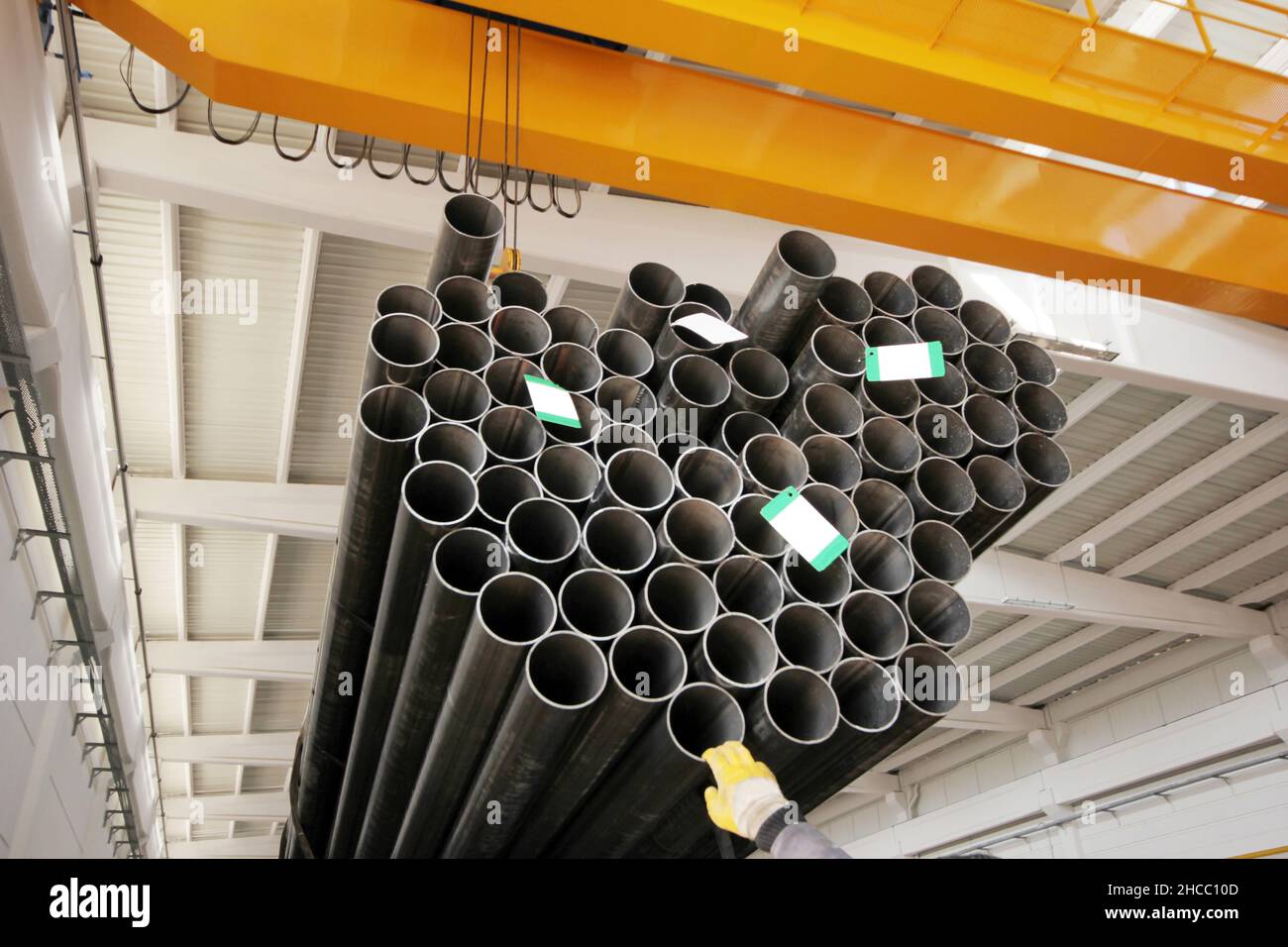 Crane picking up pipe hi-res stock photography and images - Alamy