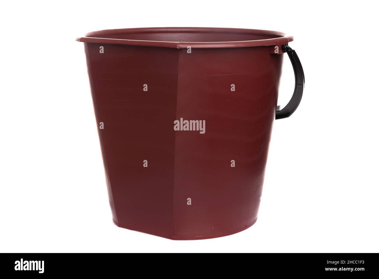 empty brown plastic bucket with black handle on white isolated ...