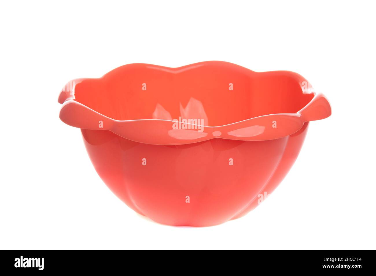 curly plastic bowl empty peach color on isolated background Stock Photo ...
