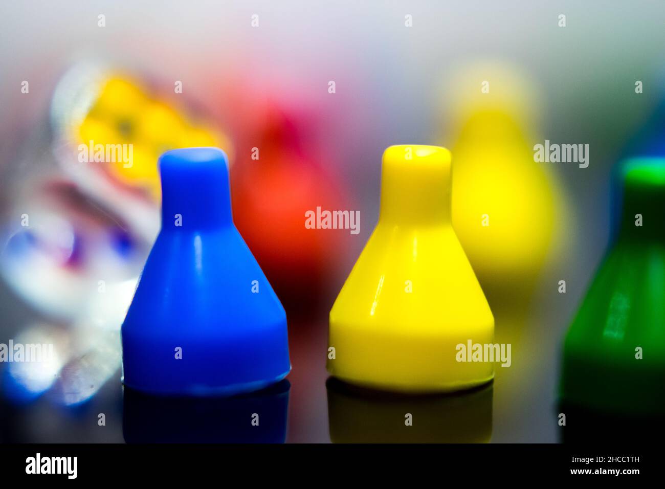 Photo of a some colorful token in a black surface Stock Photo - Alamy