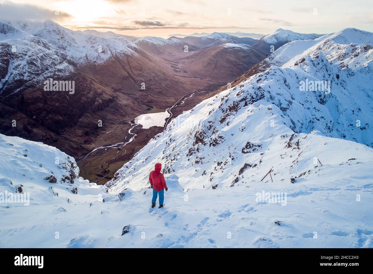 A Mountain Climber at the Snowy Summit Stock Photo - Alamy