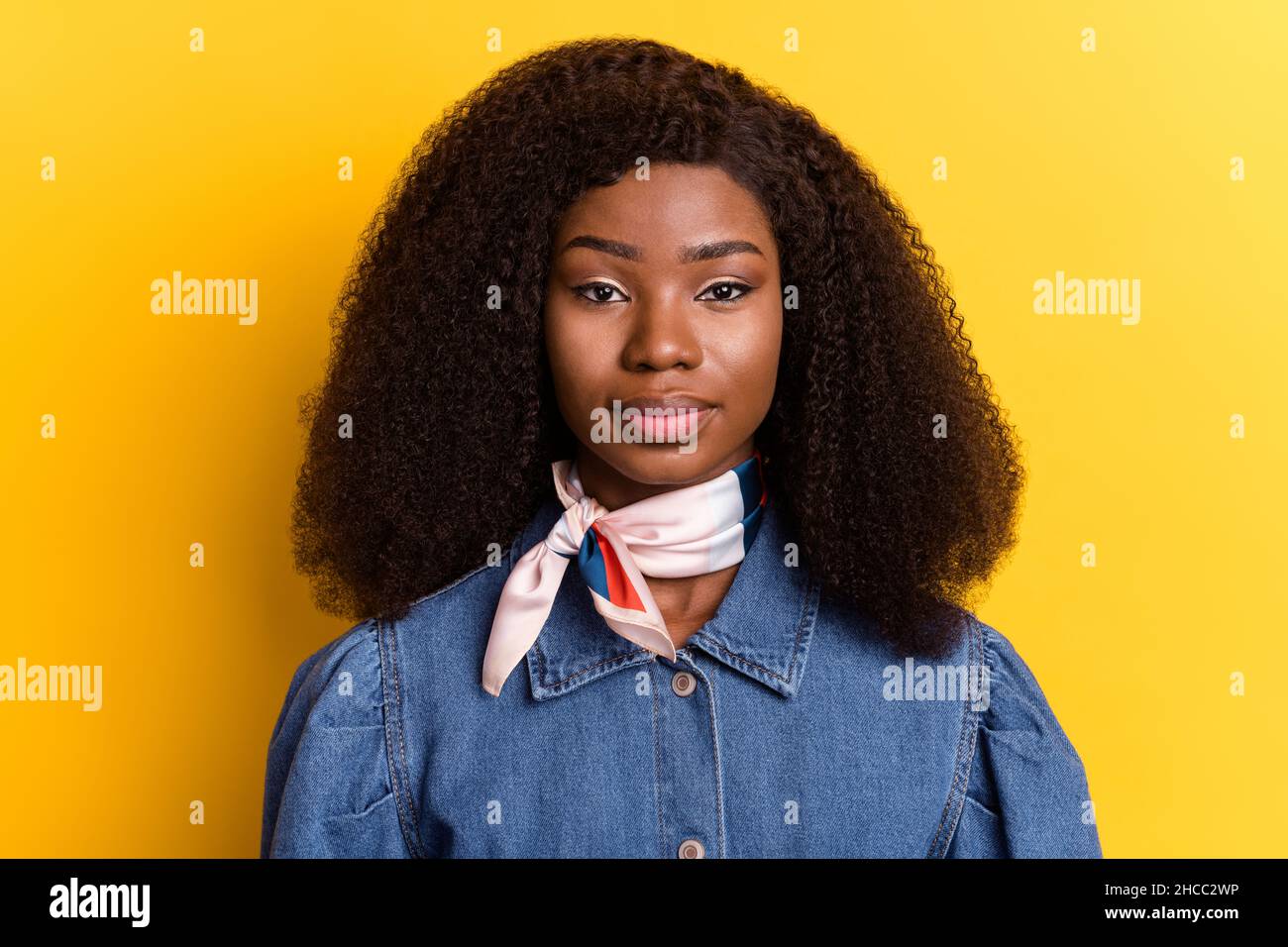 Portrait of gorgeous curly hairstyle young dark skin person look camera ...