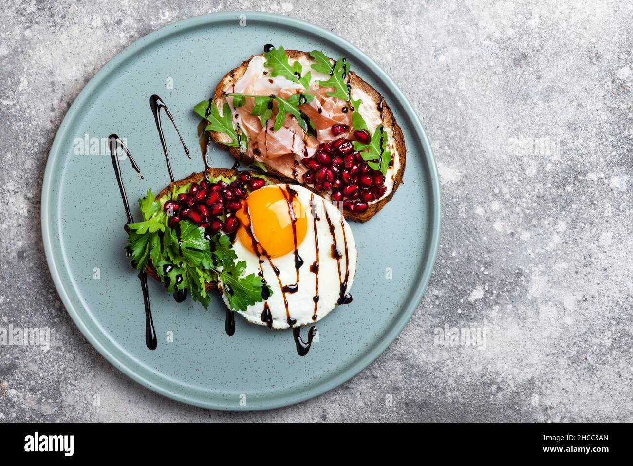 Fried egg and ham sandwich on a plate top view Stock Photo - Alamy