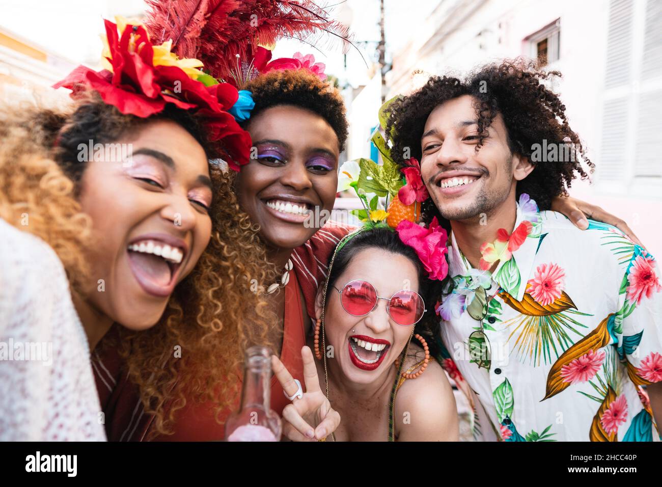 Woman and friends at street party Carnival in Brazil. People in costume ...