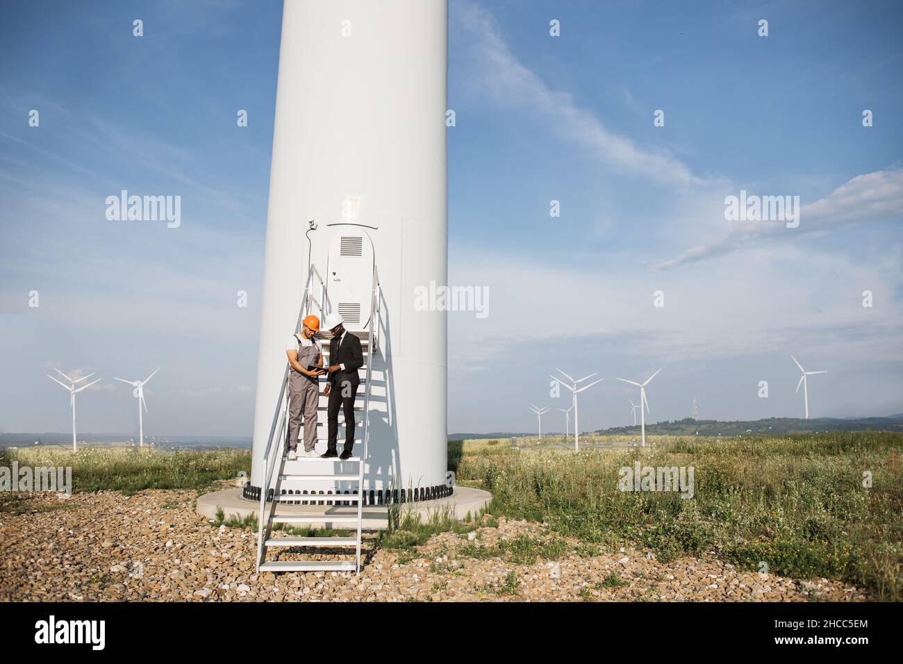 Foreman using tablet near worker hi-res stock photography and images ...