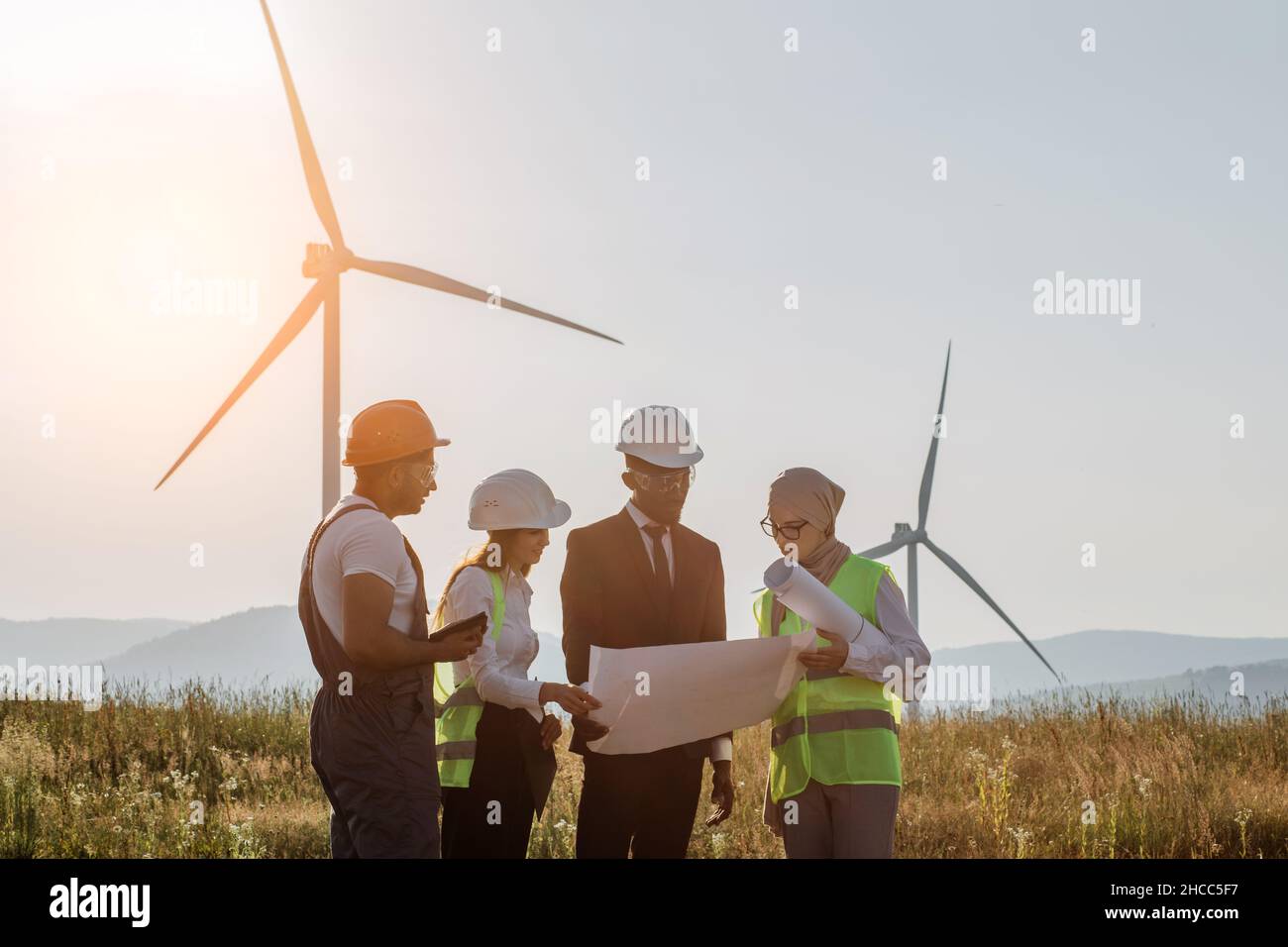 International team of business partners standing together among wind ...