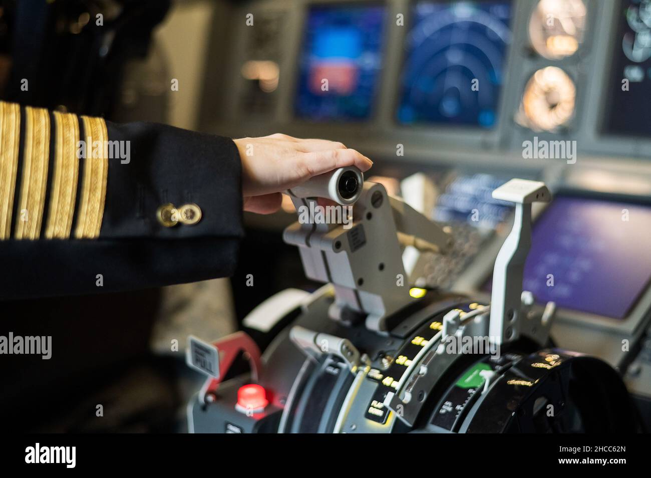 Female pilot's hand on the plane engine control stick Stock Photo - Alamy
