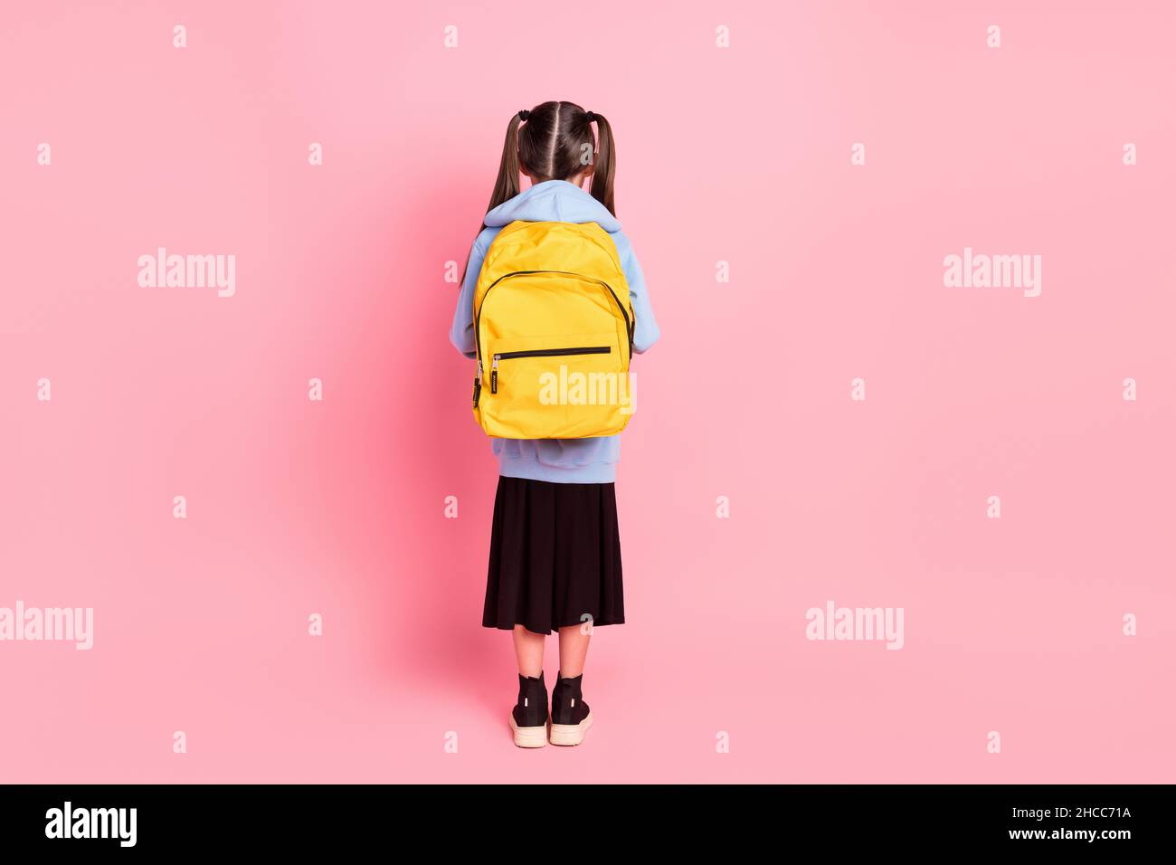 Full length body size rear back behind view of youth girl ready going ...