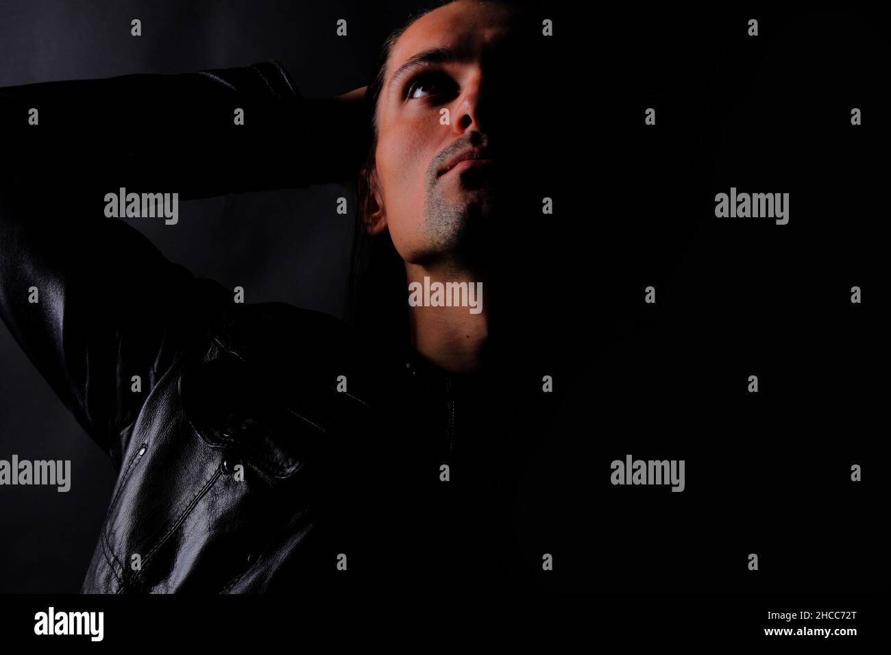 Portrait of a man with shadow on his face on a dark background Stock ...