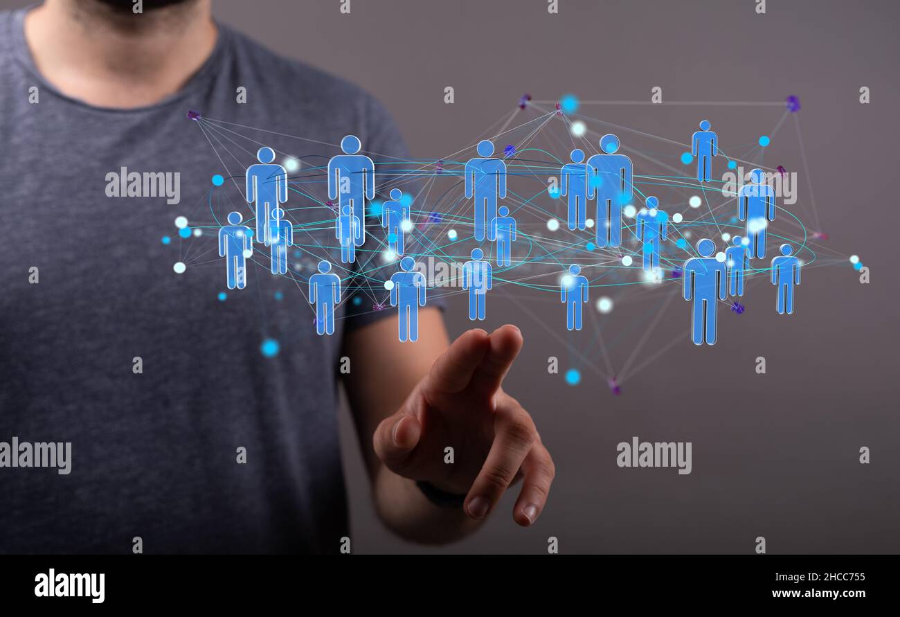 Closeup of the man's hand touching the digital human icons Stock Photo ...