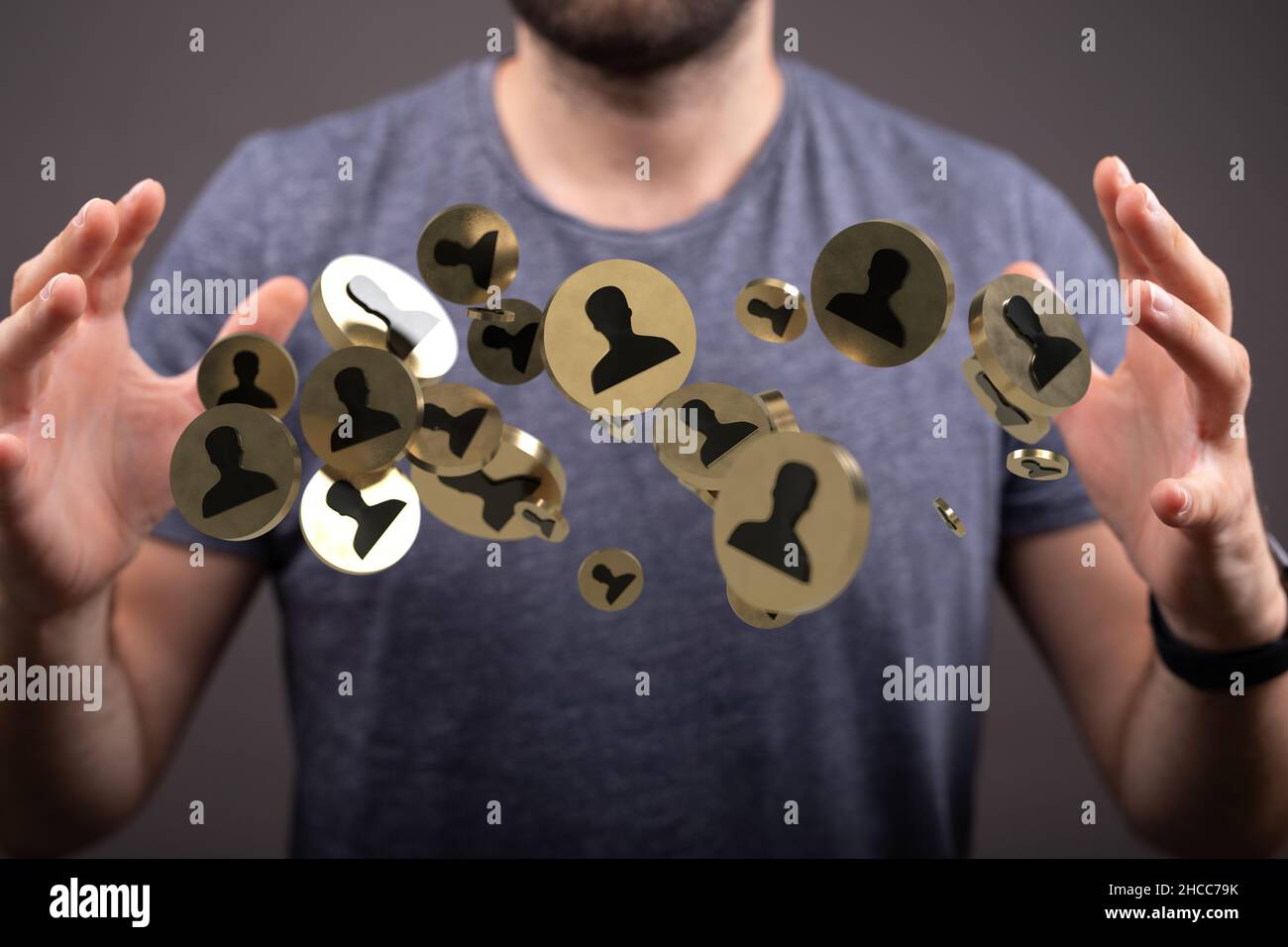 Closeup of the man's hands holding the 3D rendering group of golden ...