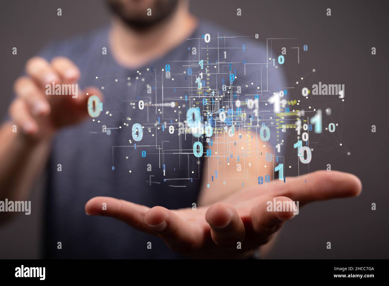 Closeup of the man's hand holding the network connections with binary ...