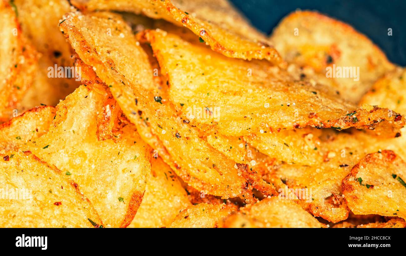 Natural fat potato chips with salt, black pepper, herbs and vegetable ...