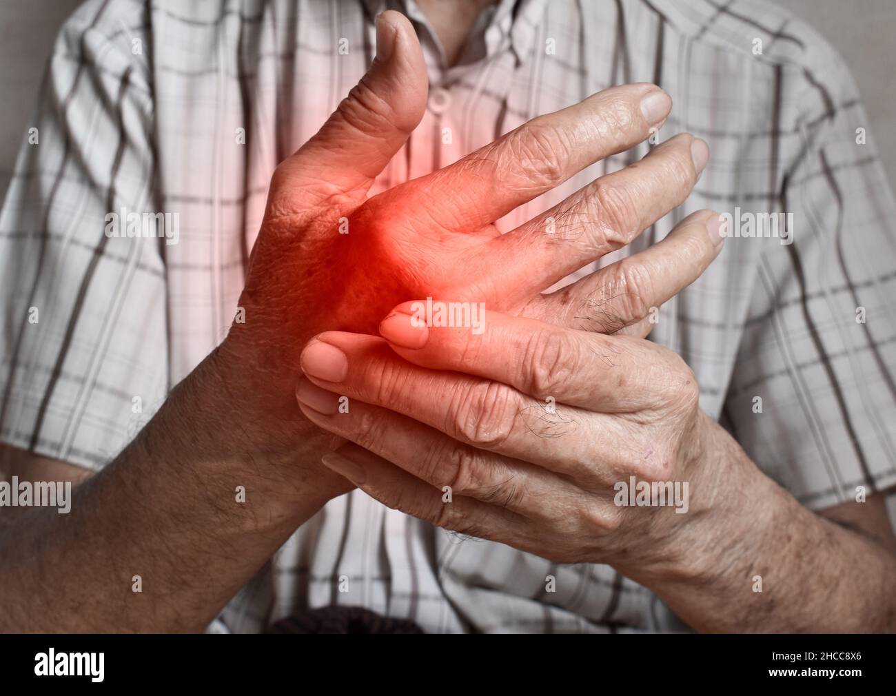 Pain in the hand of Southeast Asian elder man. Concept of hand pain ...