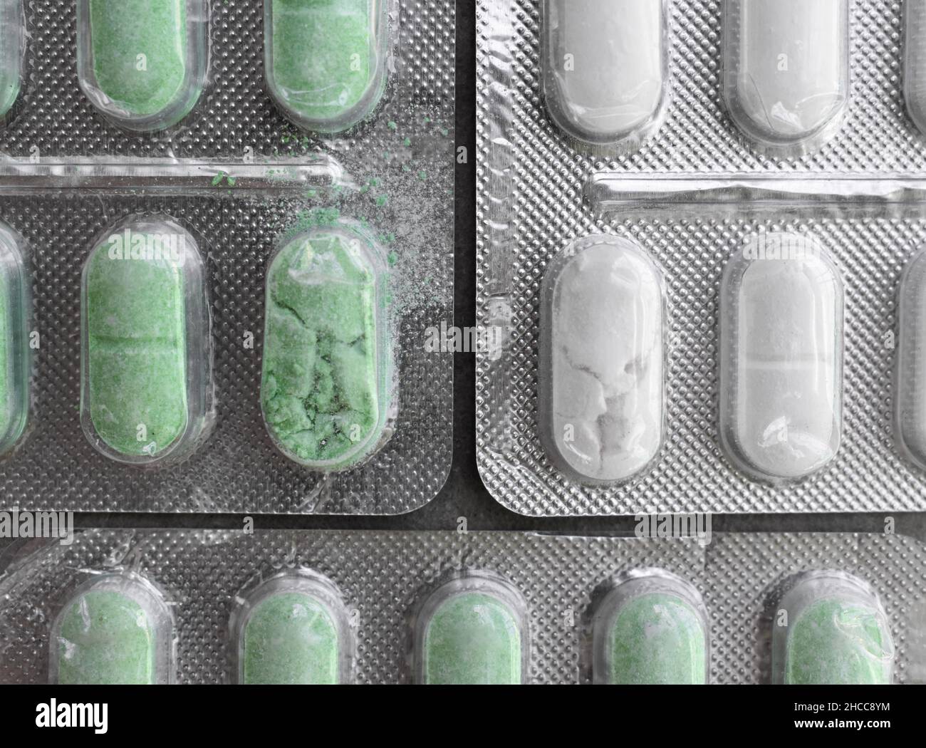 Crushed and damaged tablets in closeup view. Concept of expired drugs ...