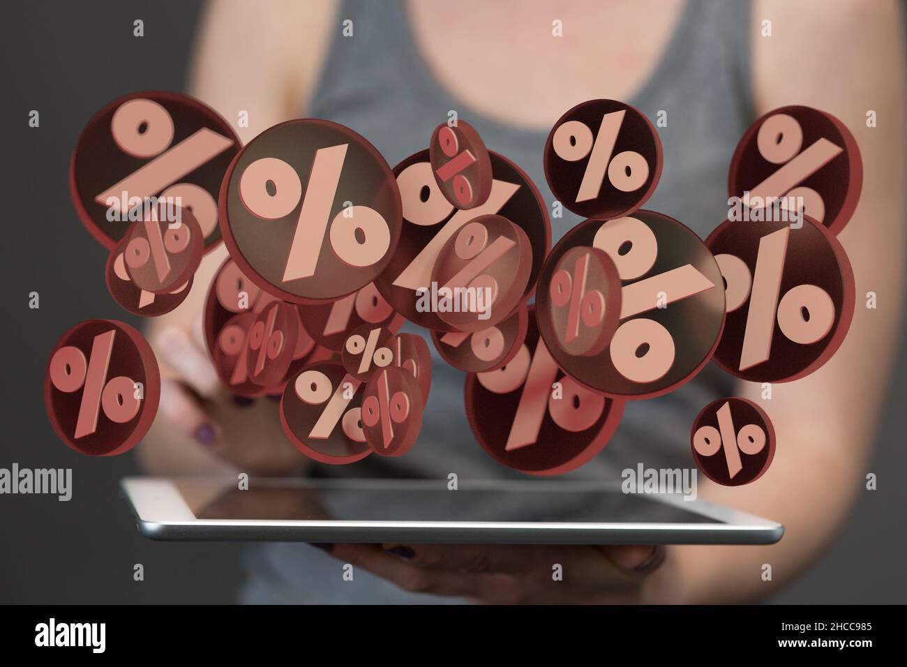 Closeup of the floating percentage signs above the tablet screen Stock ...