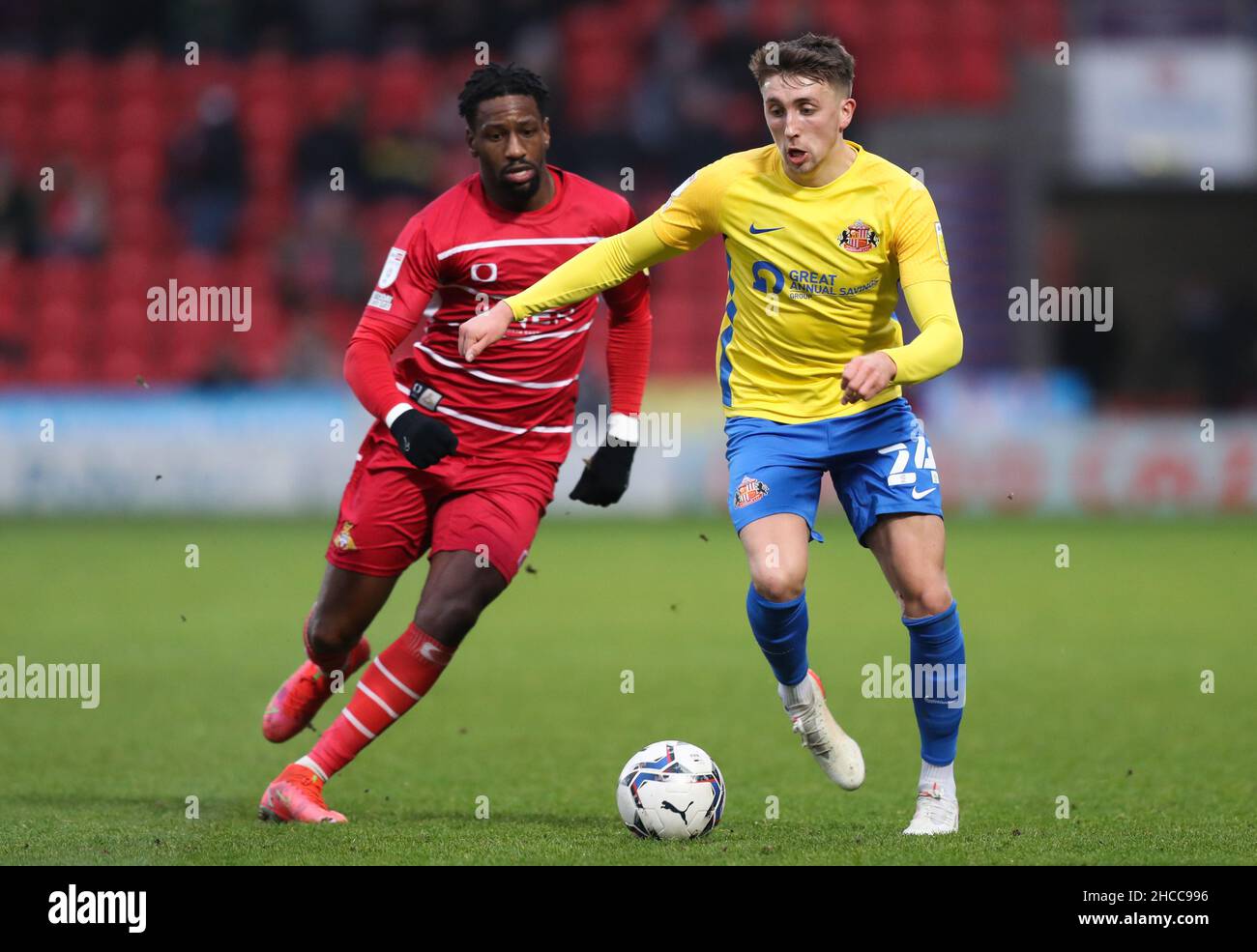 Sunderland's Dan Neil (right) and Doncaster Rovers’ Omar Bogle battle ...