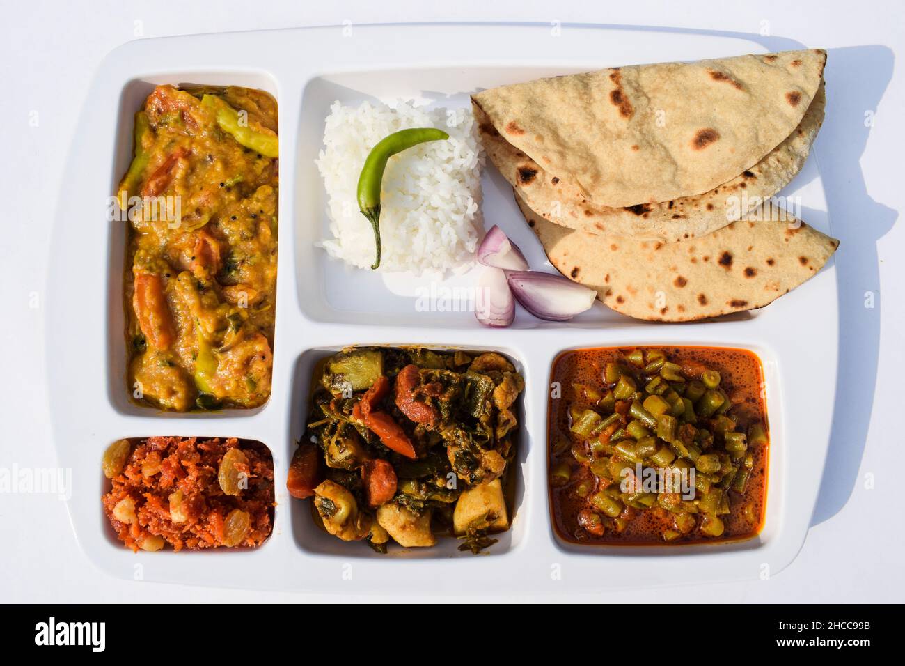 Indian Simple homemade lunch of Roti, sabji with mix veg brinjal potato ...