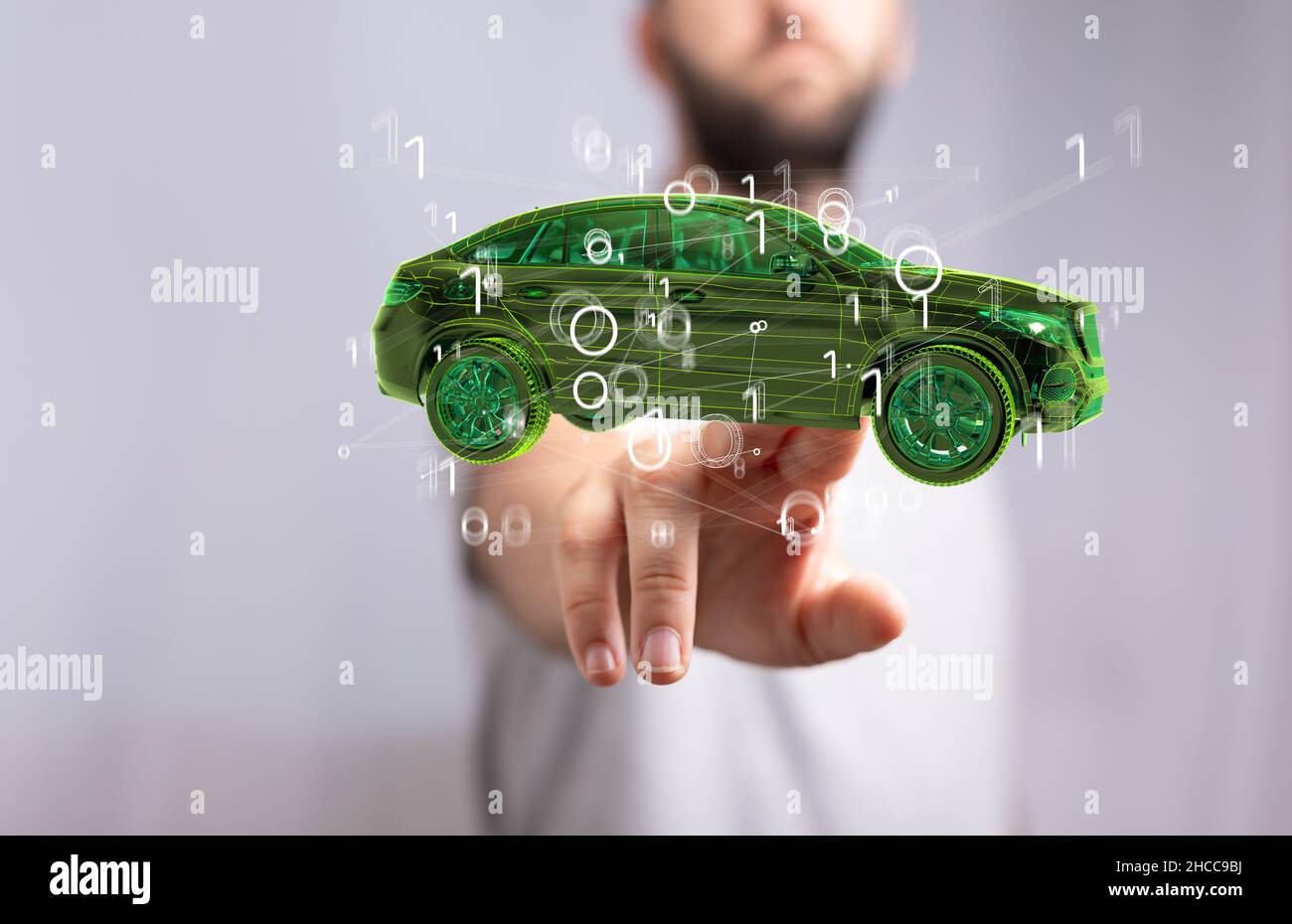 Closeup of the hand touching the 3D rendering of an electric car model ...