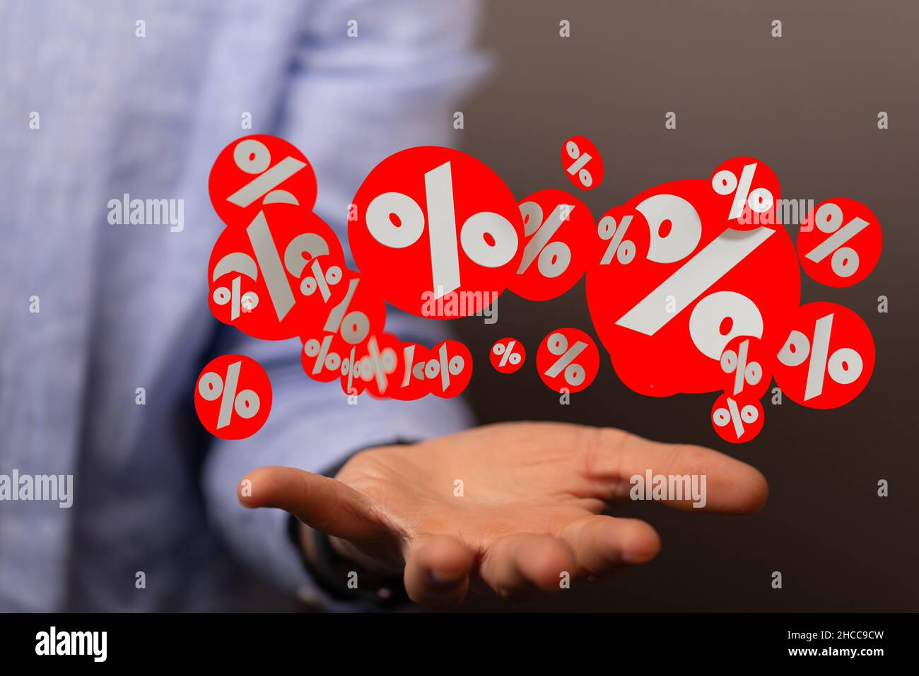 Closeup of the hand holding the floating percentage signs Stock Photo ...