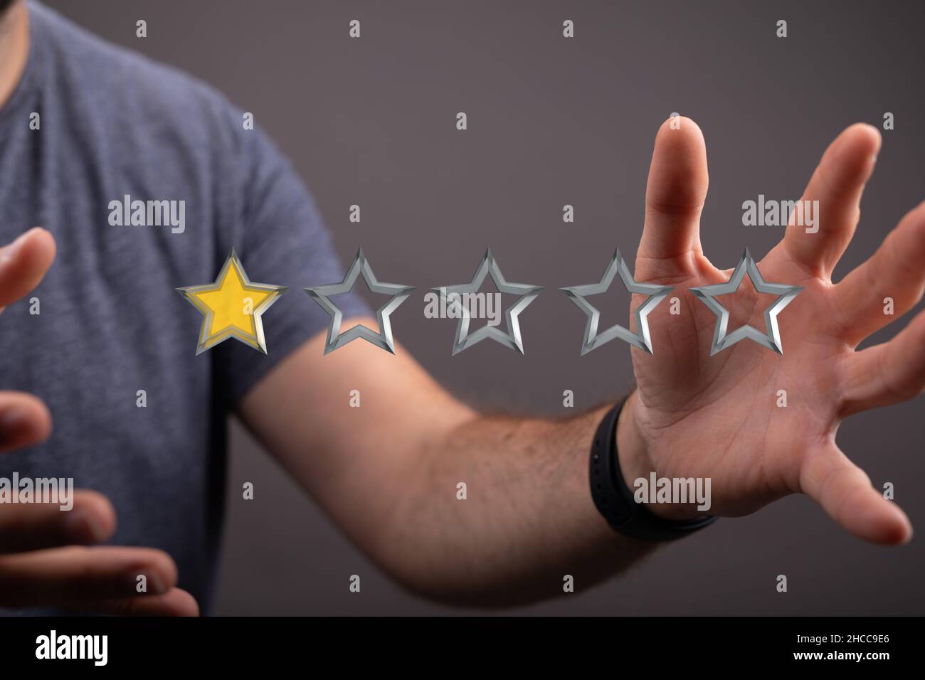 Closeup of the man's hands holding five stars ranking system Stock ...
