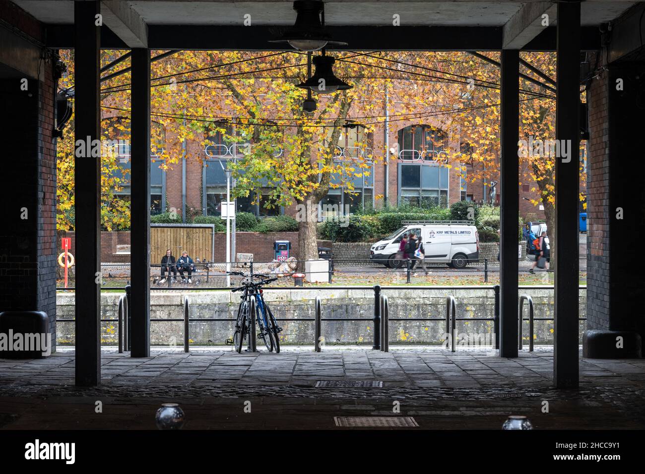 People walk along Narrow Quay on Bristol's regenerated Harbourside ...