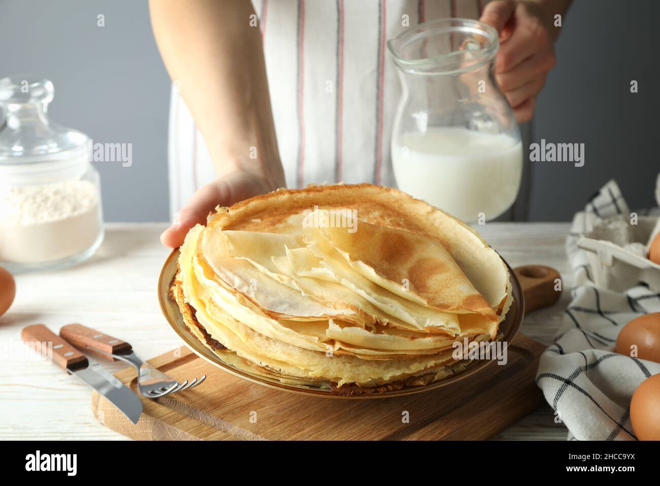 Concept of cooking crepes on white wooden table Stock Photo - Alamy