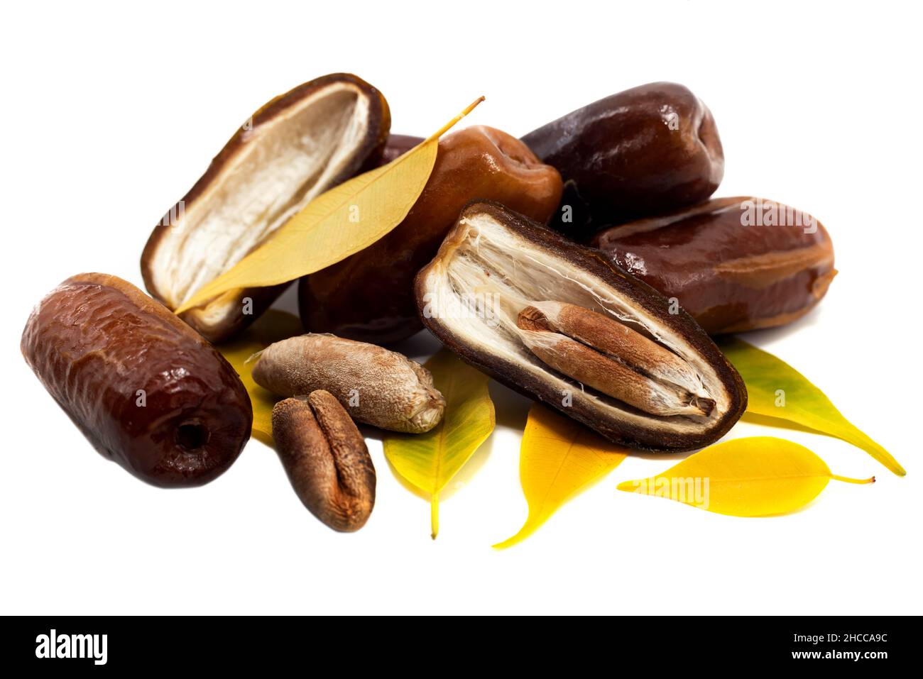 Dates on a white background. Dates isolate with seeds and leaves Stock ...