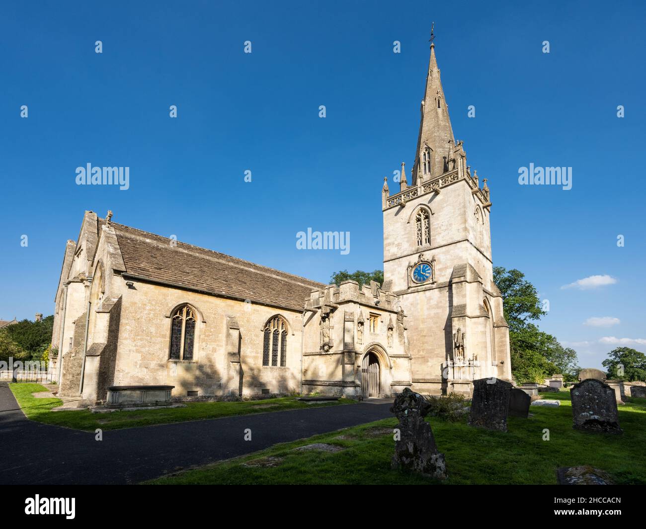 Sun shines on the traditional tower and spire of St Bartholomew's ...