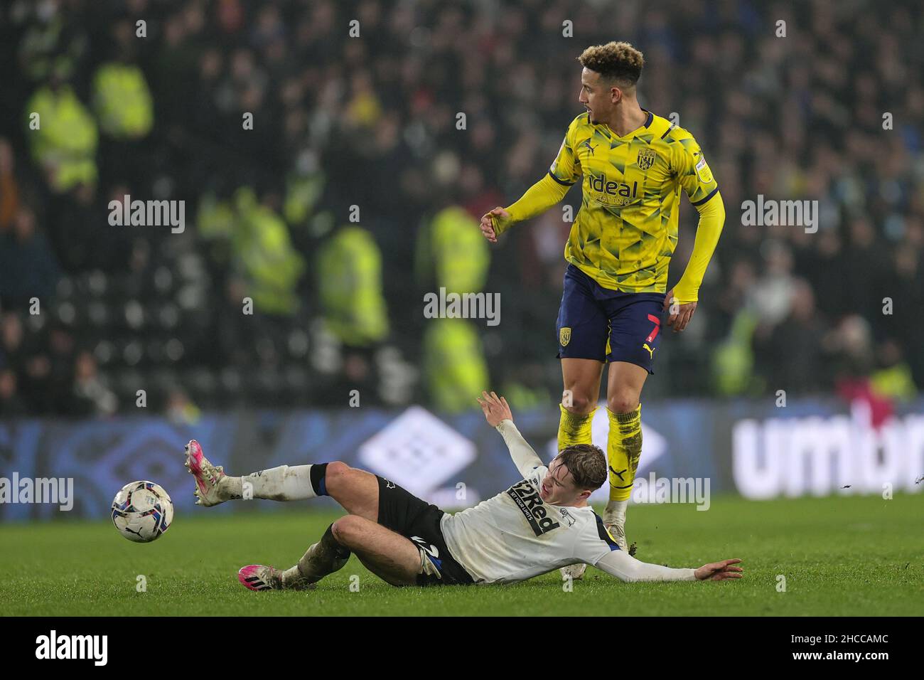 Liam Thompson #42 of Derby County challenges Callum Robinson #7 of West ...