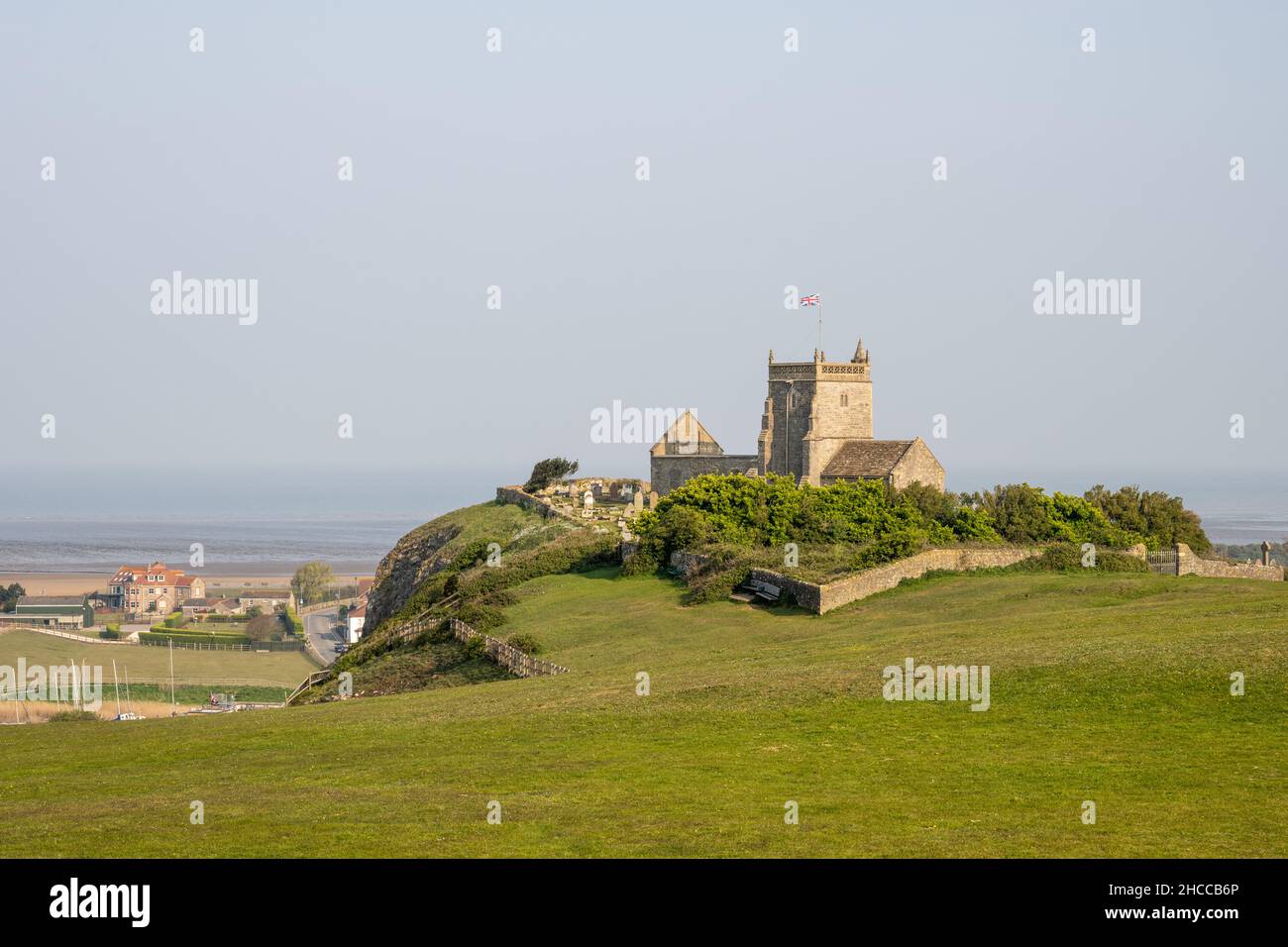The ruins of the Old Church of St Nicholas at Uphill stand on a hill ...